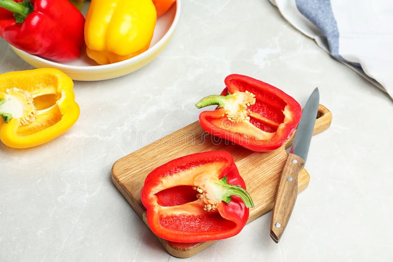 Board with Cut Bell Peppers and Knife on Table Stock Image - Image of ...