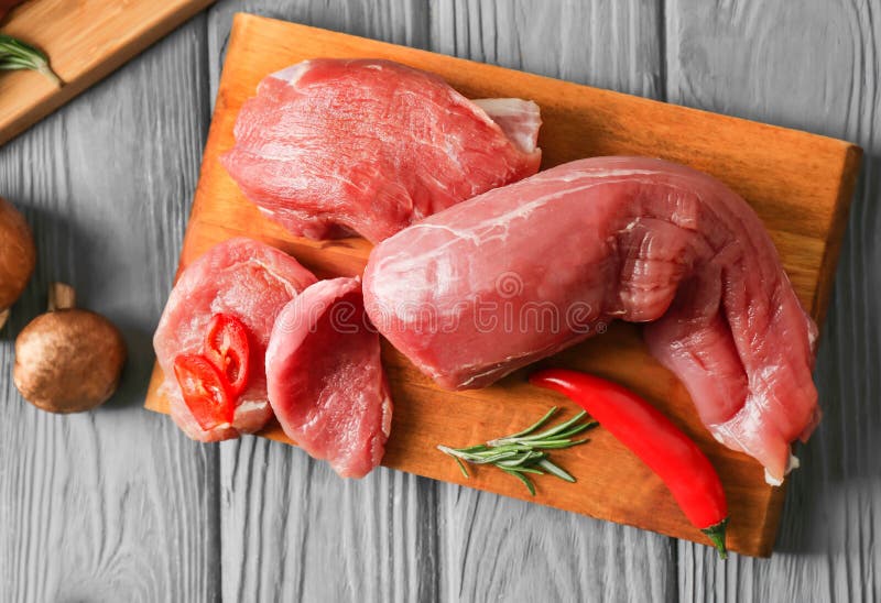Board with Fresh Pork Tenderloin on Grey Table Stock Image - Image of ...