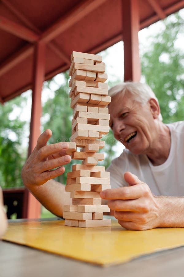 Board Game, Hand Builds Tower from Wooden Bricks Stock Image - Image of ...