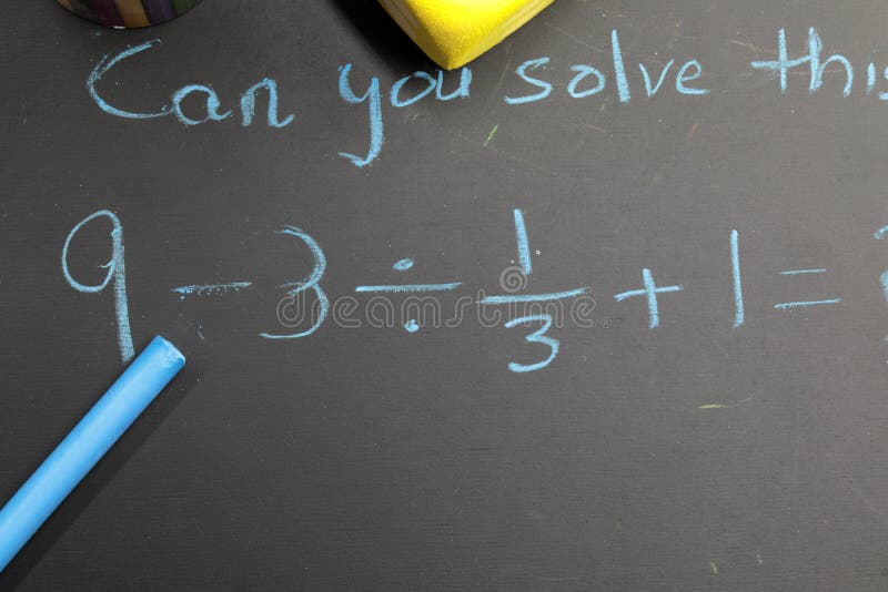 A Board with Mathematical Examples and a Teacher at the Table Stock ...