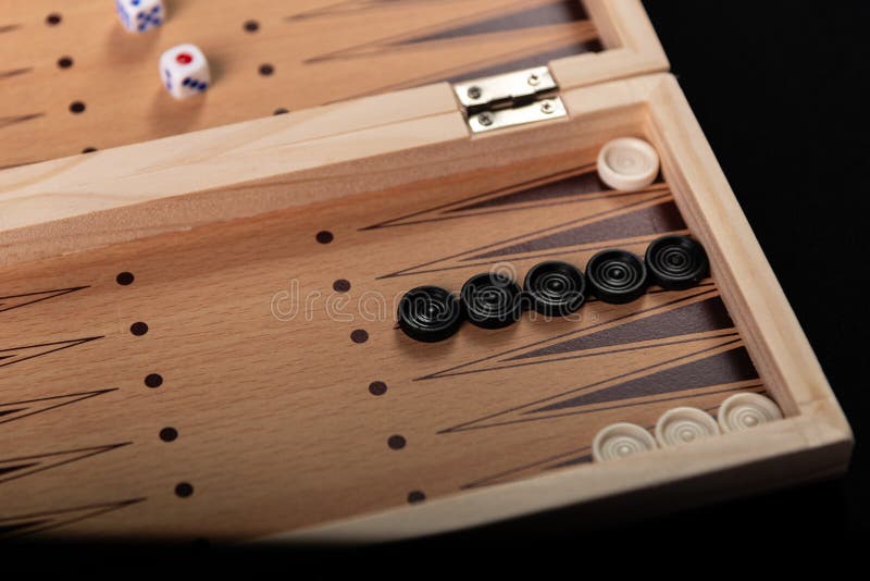 Board for Playing Backgammon with Pieces and Dice on a Black Background ...