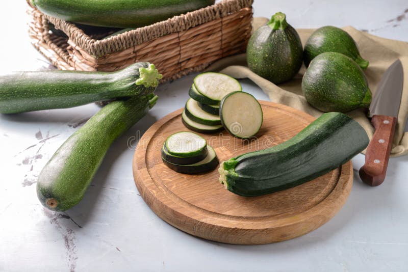 Board with Ripe Cut Zucchini on Light Table Stock Photo - Image of ripe ...