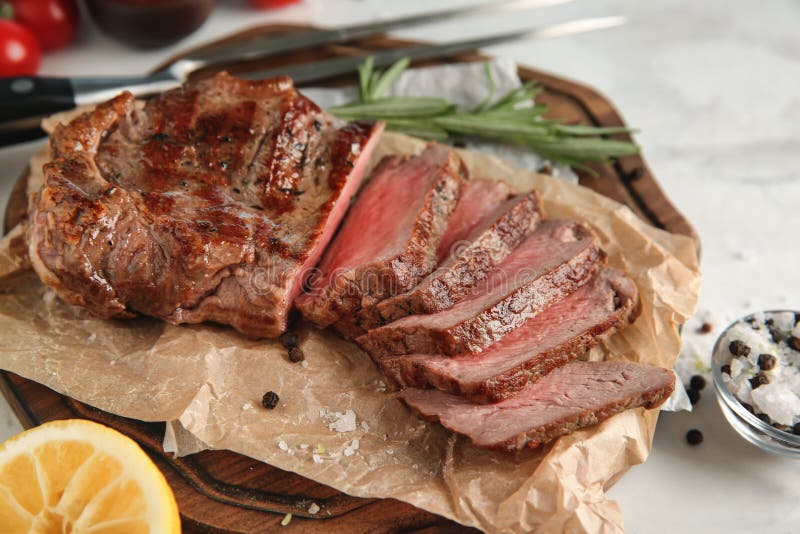 Board with Tasty Grilled Steak on Table Stock Image - Image of culinary ...