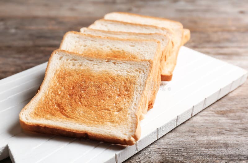 Board with toasted bread stock image. Image of slice - 115049335