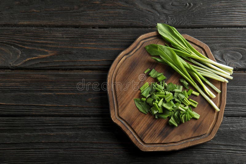 Board with Wild Garlic or Ramson on Wooden Table, Top View. Stock Image ...
