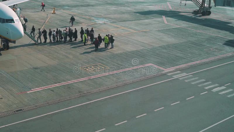 Boarding Passengers and Loading Luggage Onto the Plane Stock Footage ...