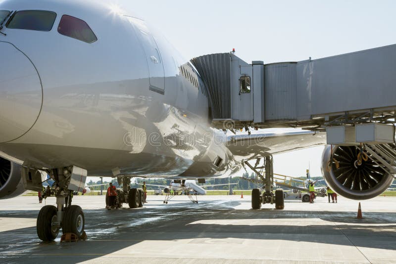 Boarding Passengers on the Plane through the Boarding Bridge. the Plane ...