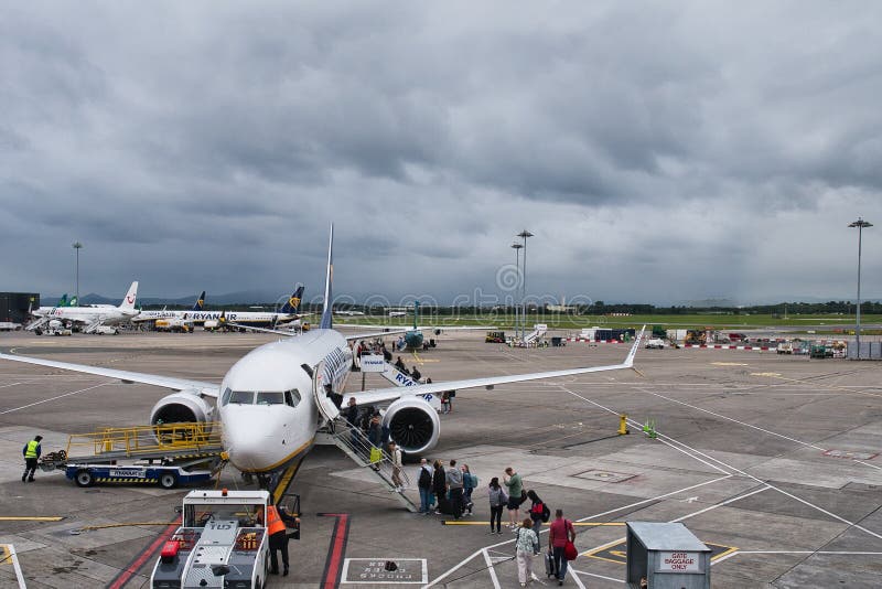 Boarding the Plane on the Tarmack at the Airport Editorial Stock Photo ...