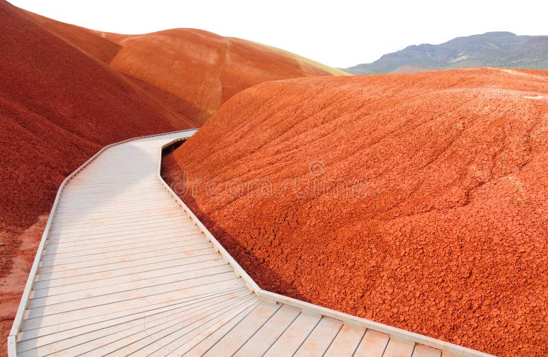 Boardwalk through Mounds of Red Earth Stock Image - Image of desert ...