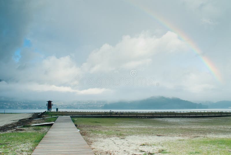 Boardwalk and rainbow stock photo. Image of mouth, coast - 24797612