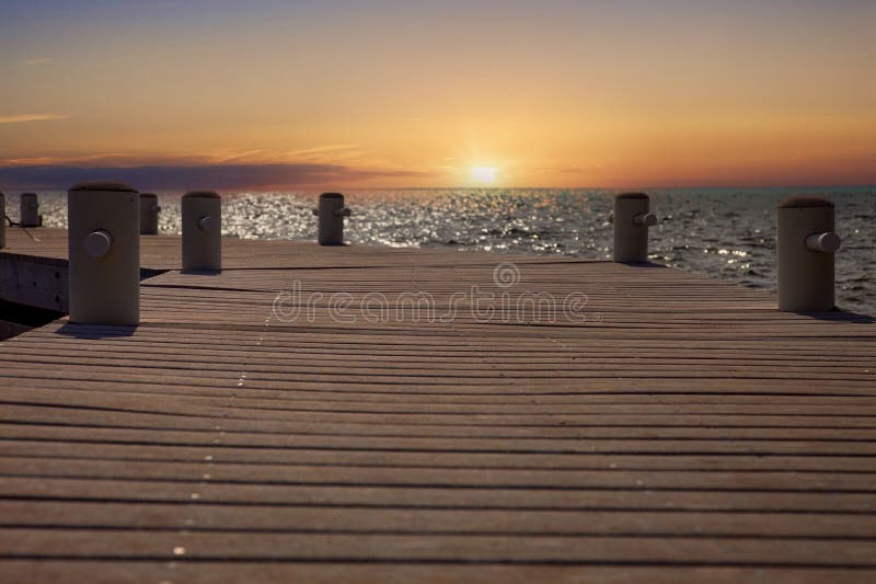 Boardwalk View on the Sun Setting on the Horizon Stock Photo - Image of ...