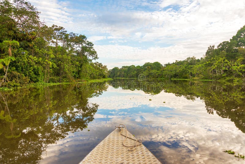 Boat and Amazon Reflection stock photo. Image of south - 57921758