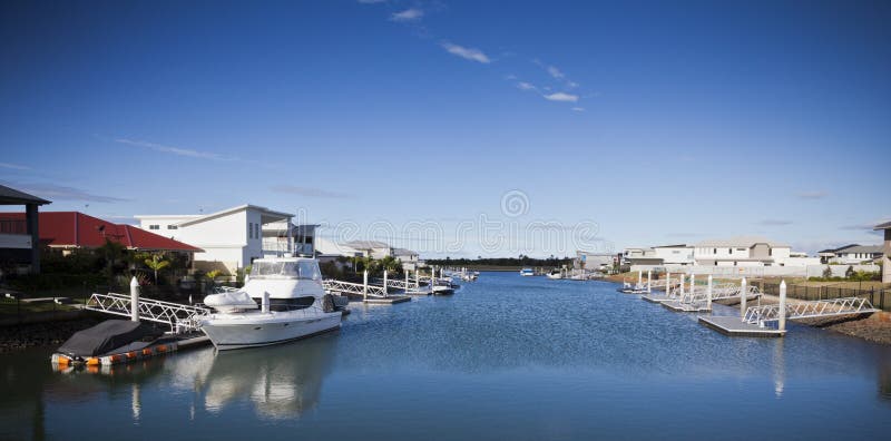 Boat Anchored in Front of a House Stock Image - Image of marina, living ...