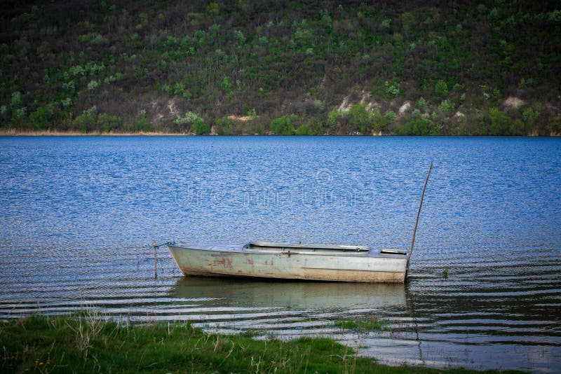 Boat anchored to the bank stock image. Image of anchored - 91462341