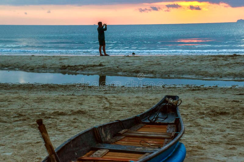 Boat on the Beach at Sunset Stock Photo - Image of silhouette, sunset ...