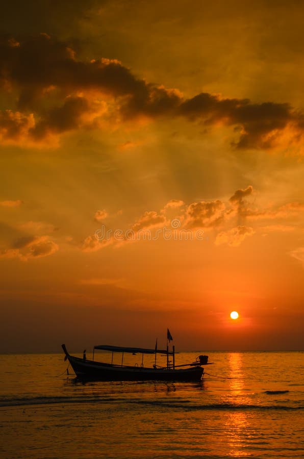Boat at beach and sunset stock photo. Image of shadow - 34848360