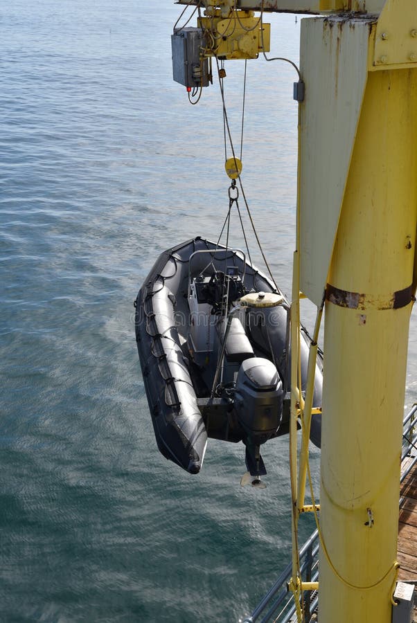 Boat Being Hoisted from Ocean Stock Image - Image of nautical, seascape ...