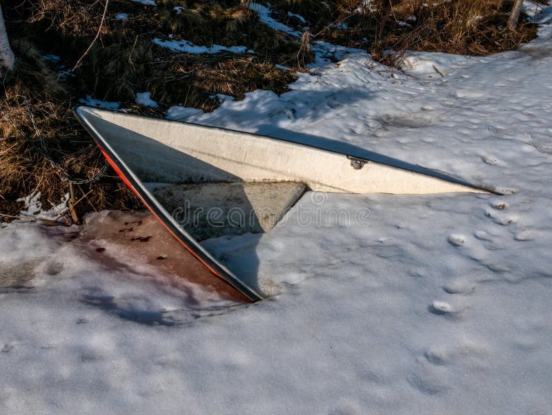 Boat Buried Underneath the Snow and Ice on Shore Stock Image - Image of ...