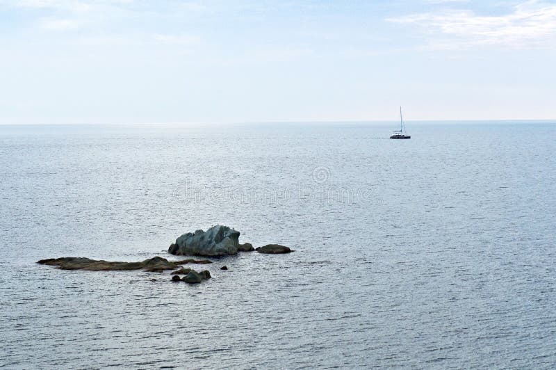 A boat, cliff and sea stock photo. Image of cloudy, beautiful - 25864470