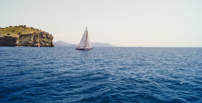 Boat at cliff stock image. Image of wave, rock, travel - 54440191