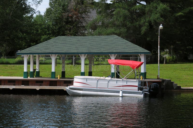 Boat at the covered dock stock photo. Image of boat, roof - 16100558