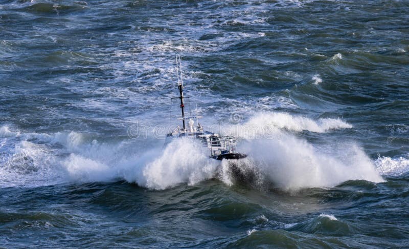 Boat Crossing a High Wave while Sailing in the Ocean Stock Photo ...