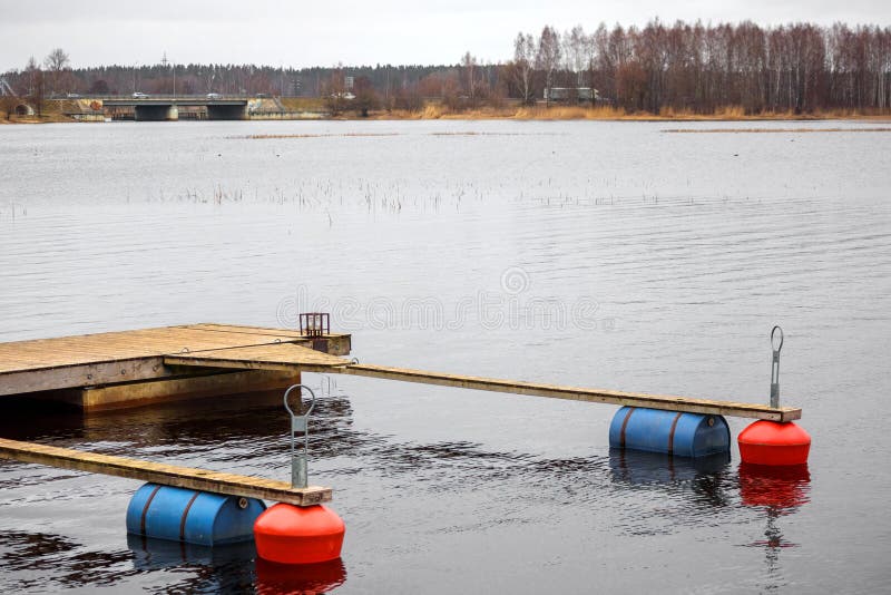 .a Boat Dock with a Boardwalk and Buoys on the Water Stock Photo ...