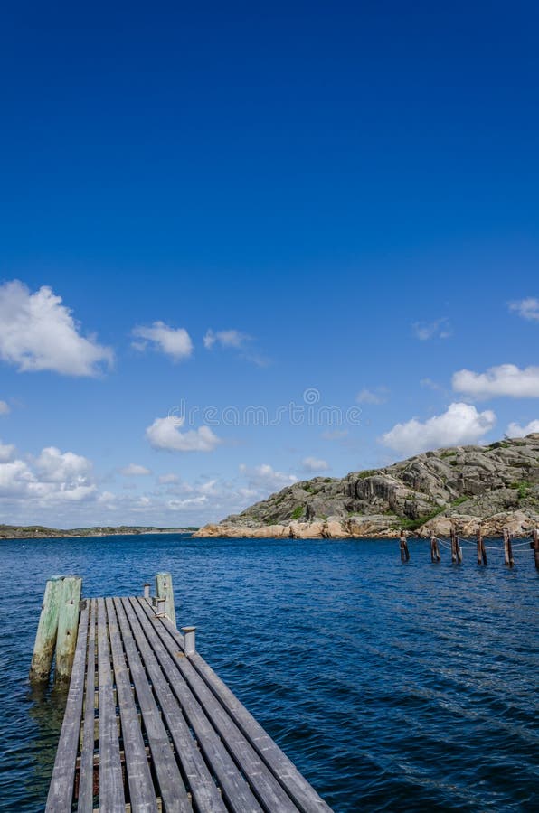 Boat Dock and Cliffs in the Background Stock Image - Image of boat ...