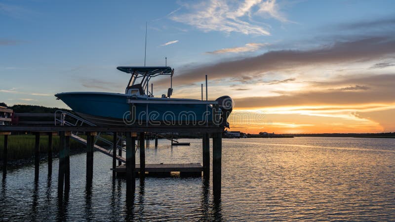 Boat on a Dock in an Inlet stock photo. Image of transportation - 146332302