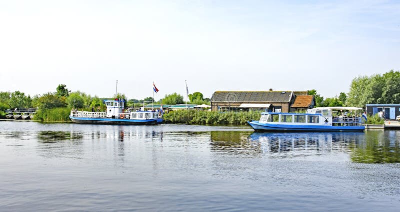 Boat at a Dock in Kinderdijk, Holland Editorial Photo - Image of pier ...