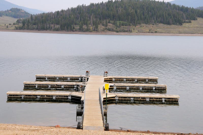Boat Dock at a Mountain Lake Stock Image - Image of water, fishing ...