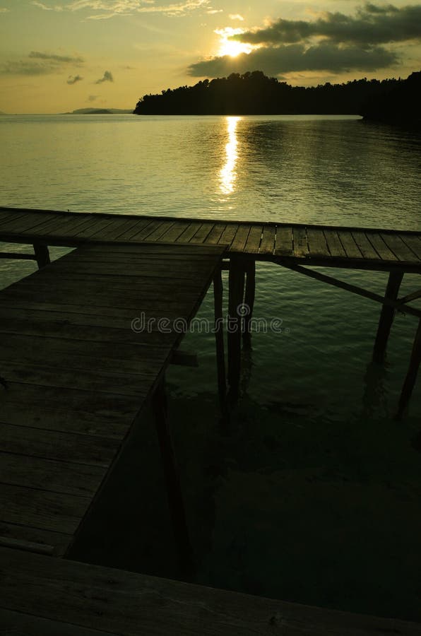 Boat dock on sunset stock photo. Image of land, tropic - 22128022