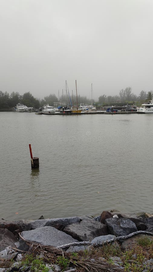 Boat Docked during Raining Season Stock Image - Image of shore, morning ...