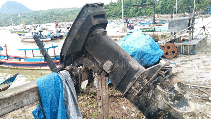 The Boat Engine Was Broken and Lying on the Edge of the Beach. Stock ...