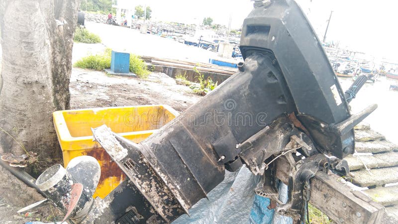 The Boat Engine Was Broken and Lying on the Edge of the Beach. Stock ...