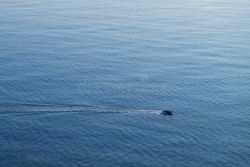A Boat with Fishermen in the Sea. One Boat Floats on the Surface of the ...