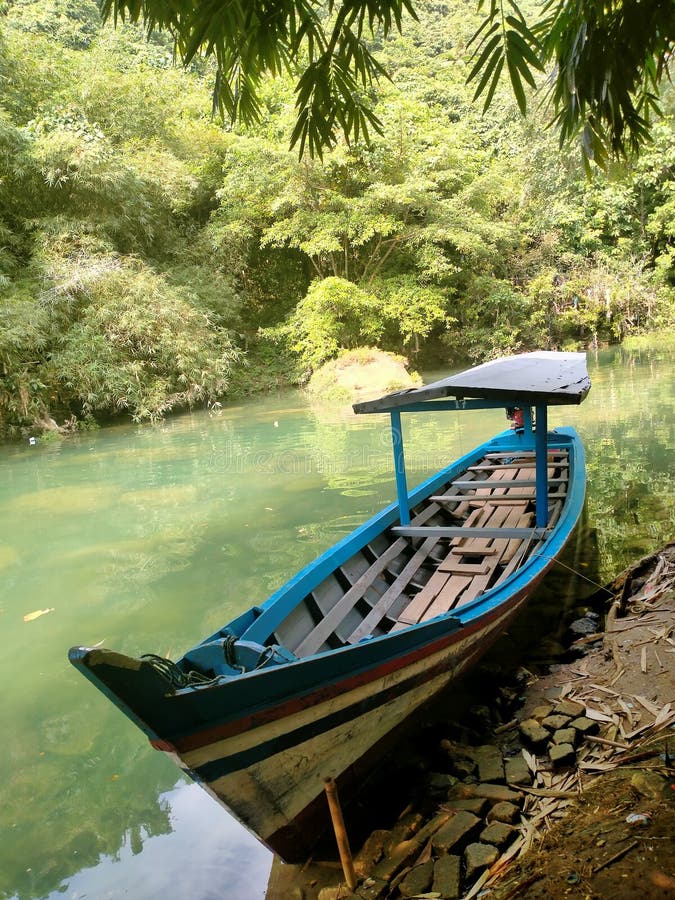 Boat Fishing on the Riverside in the Forest during the Day Stock Image ...