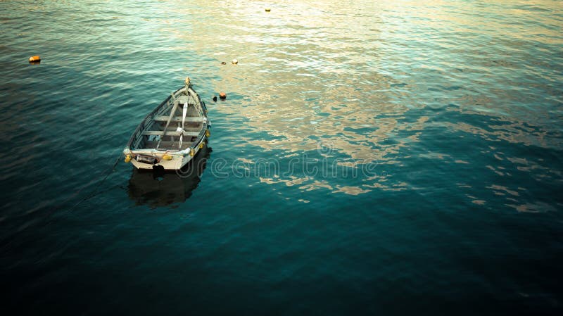 Boat on flat water stock photo. Image of hazey, tide - 48800678