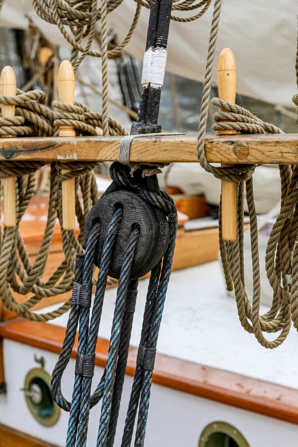 A Boat Has a Number of Ropes Hanging from the Deck Stock Image - Image ...