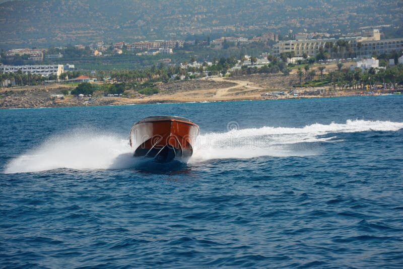 The Boat at High Speed Performs a Sharp Turn, Spraying Water To the ...