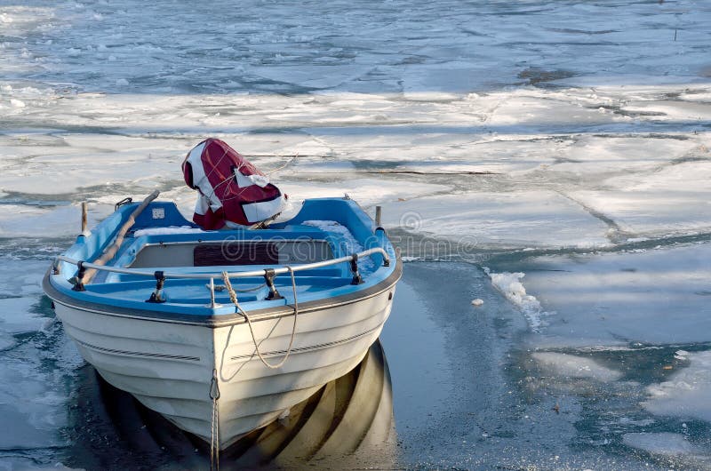 Boat in icy lake stock photo. Image of kastoria, winter - 35832182