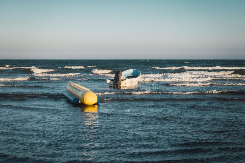 Boat with an Inflatable Float on the Sea Waves Stock Image - Image of ...