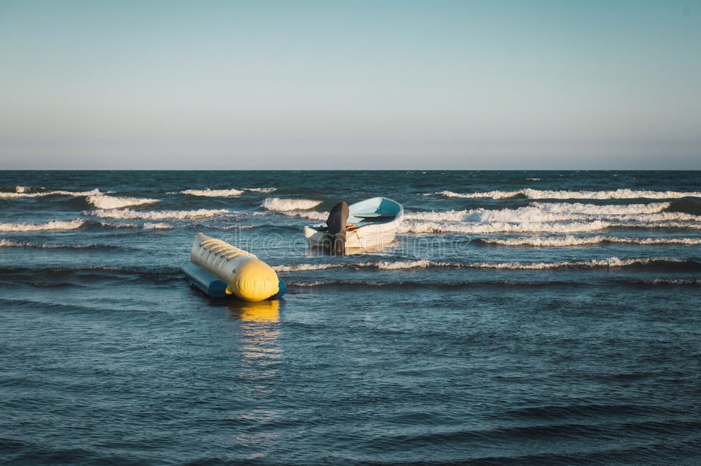 Boat with an Inflatable Float on the Sea Waves Stock Image - Image of ...