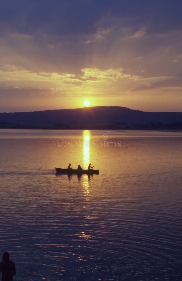 Boat on lake at sunset stock image. Image of orange, landscapes - 7277873
