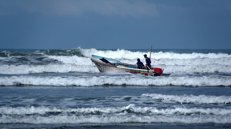 Boat Launching Over the Suf from the Beach Stock Photo - Image of ...