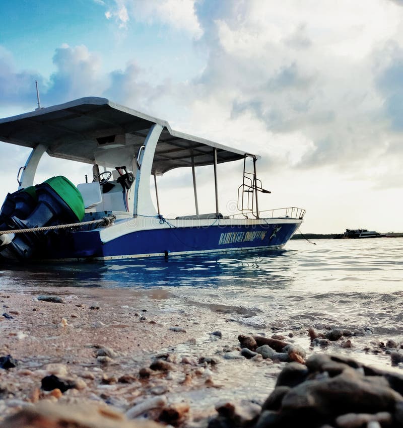 A Boat Leaning on the Beach Editorial Stock Photo - Image of landscape ...