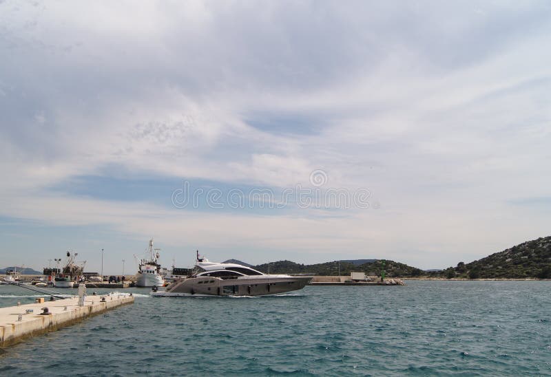 Boat leaves the harbor stock image. Image of vessel, nautical - 53460019