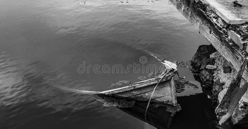 Boat left stock photo. Image of sunken, boat, left, water - 153784434