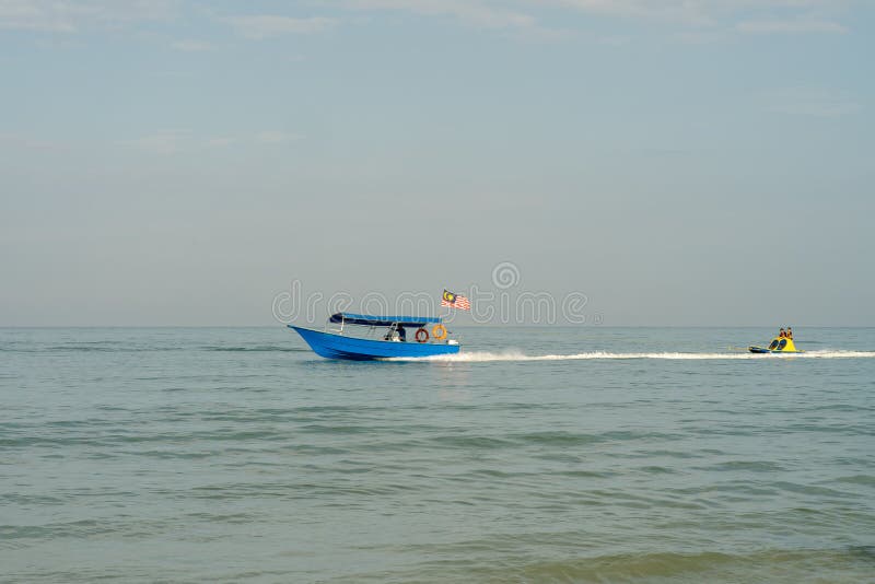 Boat with Malaysian Flag is Pulling Children Standing on the Floating ...