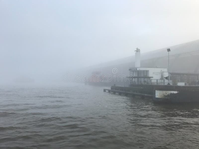 Boat in the Mist in Amsterdam Harbor Editorial Photography - Image of ...